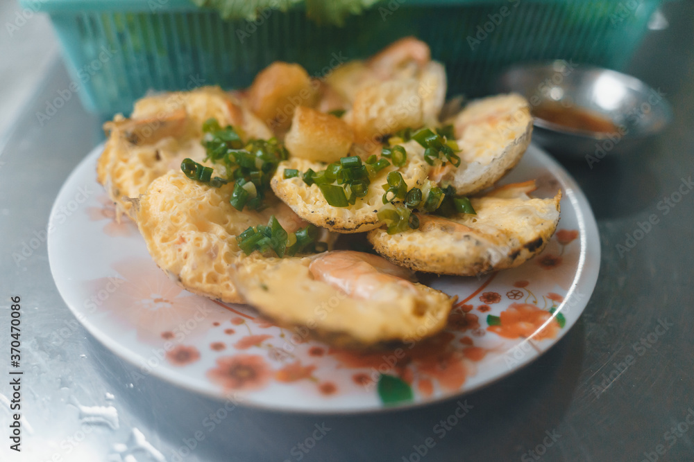 Vietnamese street food "banh can" make by rice powder with rice flour ...