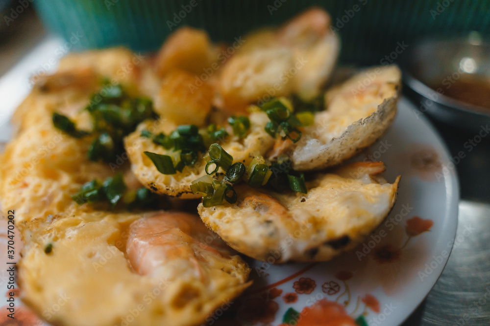 Vietnamese street food "banh can" make by rice powder with rice flour ...