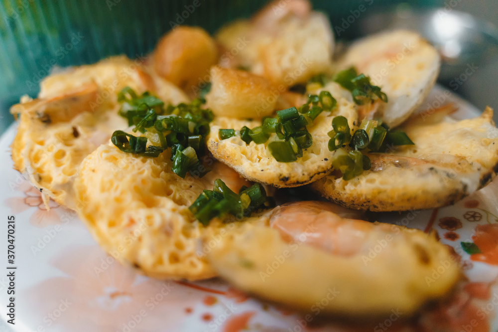 Vietnamese street food "banh can" make by rice powder with rice flour ...
