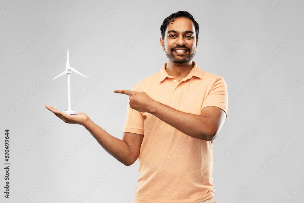 sustainable energy, power and people concept - happy smiling young ...
