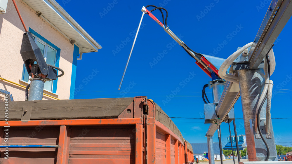 Probe tester plunges into the truck trailer to collect wheat for ...