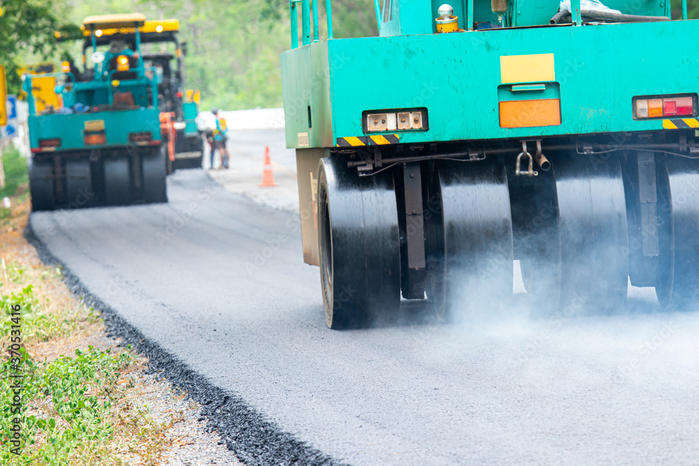 Heavy machinery Compacted asphalt road In the construction of intercity ...