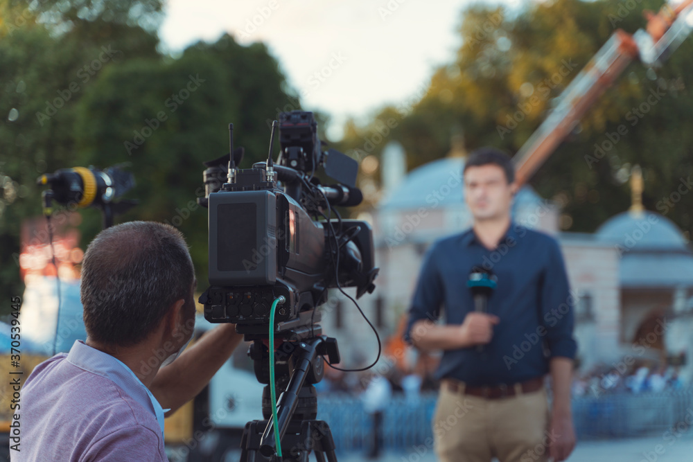 Behind the scene concept. Cameraman working on professional camera ...