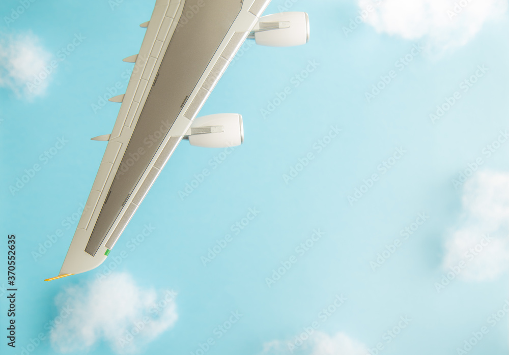 Travel concept. Top view of an airplane wing flying. Studio shot of an ...