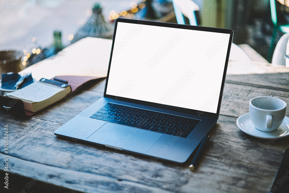 Modern opened laptop computer connected to wi fi internet in coworking ...