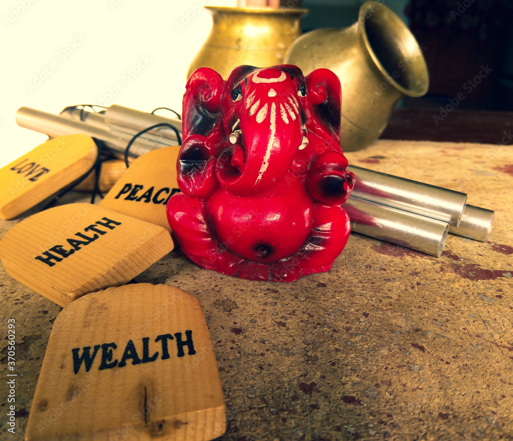 Red ganesh deva sculpture portrait picture with pots and Bells in the ...