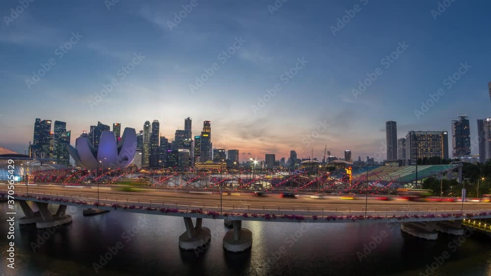 Aerial view over Helix Bridge and Bayfront Avenue with traffic day to ...