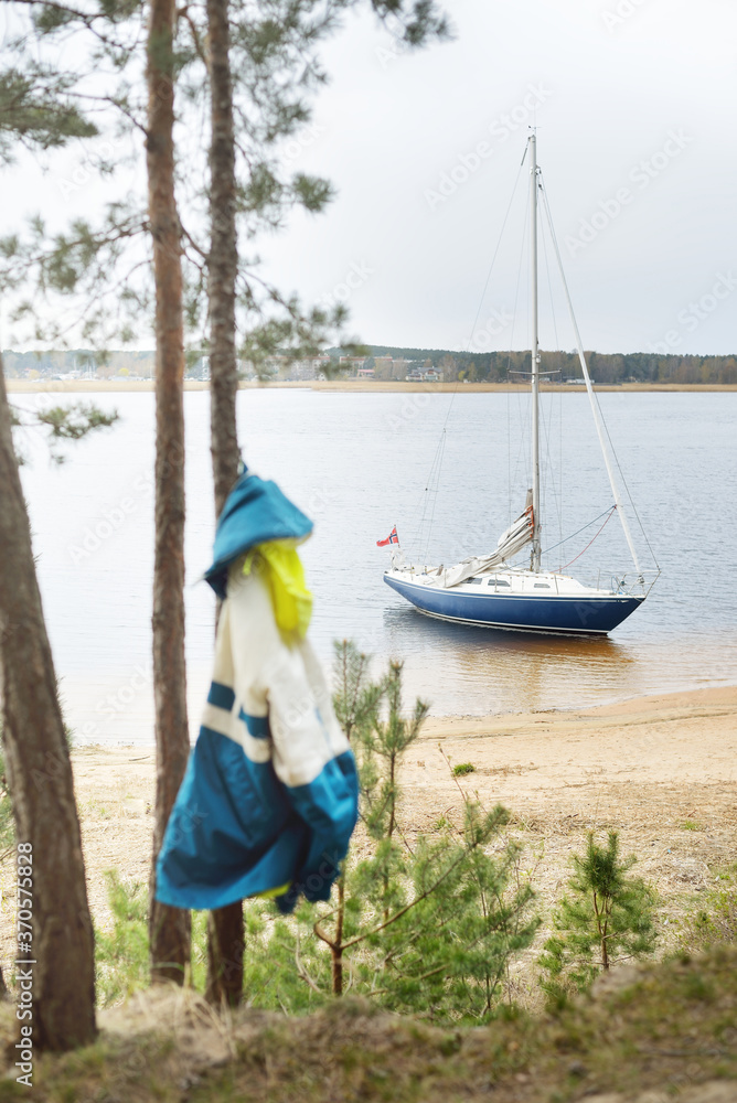 Blue yacht anchored in the shallow water near the sandy beach. Lule ...