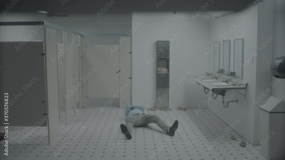Office employee collapsed on public bathroom floor Stock ビデオ | Adobe Stock
