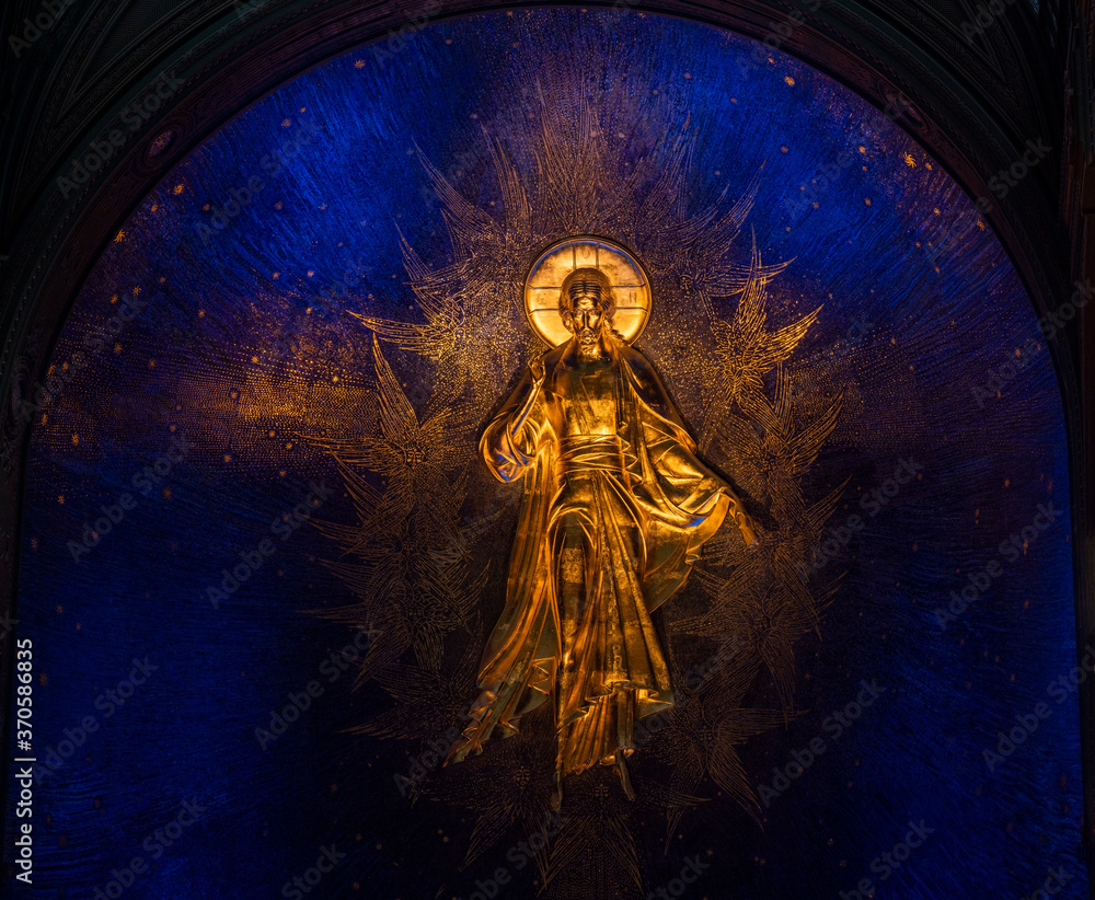 bright frescoes and symbolic objects of a religious nature on the wall ...