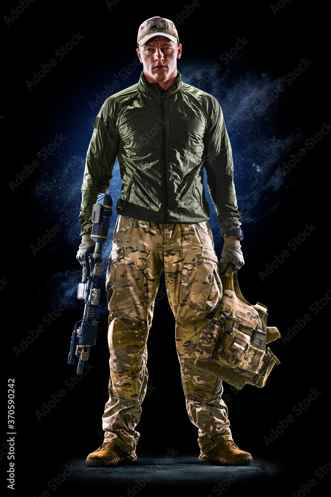 Army soldier in Protective Combat Uniform holding Special Operations ...