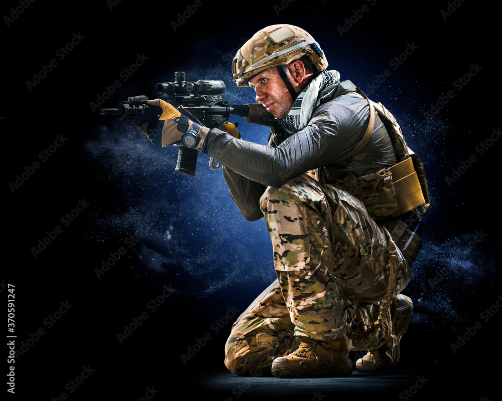 Army soldier in Protective Combat Uniform holding Special Operations ...