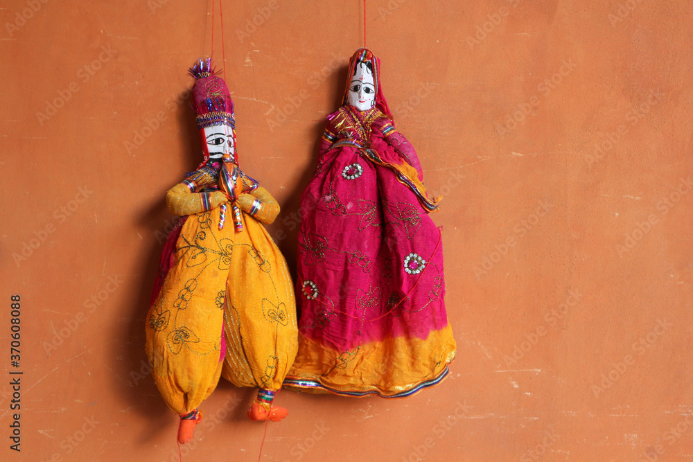 Indian traditional dolls on the wall in Jaipur. Stock Photo | Adobe Stock