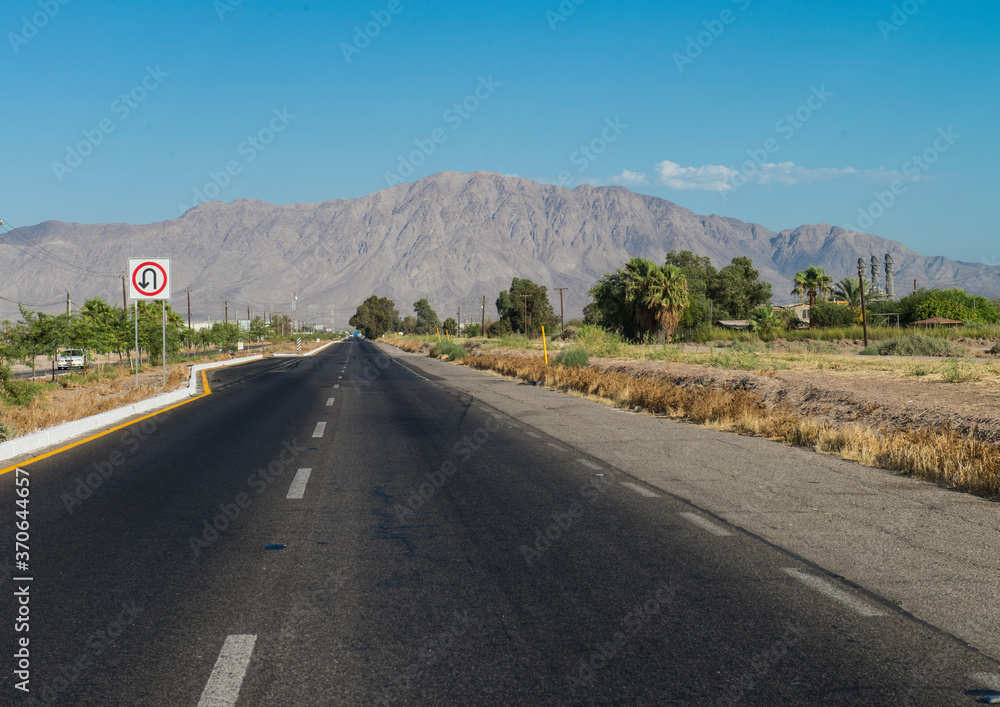 Road from Mexicali to Tijuana with mountain in the background and a ...