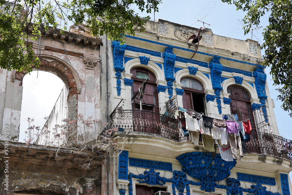 Dilapidated and collapsed buildings line the lower end of the Prado ...