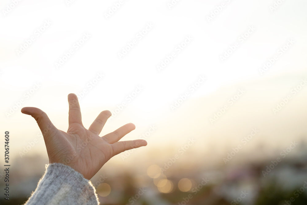 Women raise their hands to ask for blessing from God. Stock Photo ...