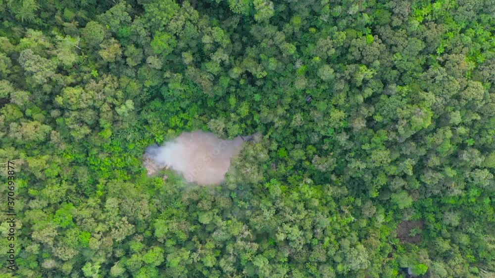 Aerial view of lake with volcanic activity in the jungles of Mindanao ...