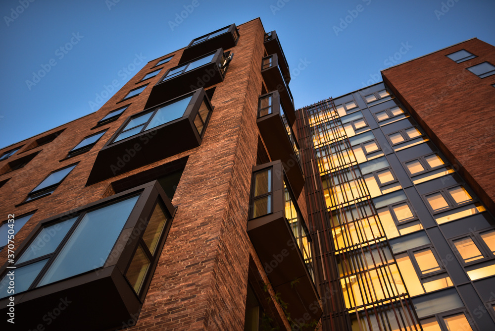 Exterior of a modern multi-storey residential building made of bricks ...