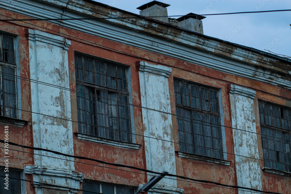 Urban landscape, the building of the former factory. Facade with ...