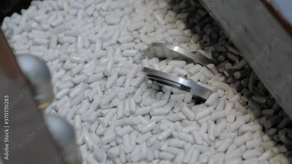 Tumble finishing process at factory - automated trough vibrator machine ...