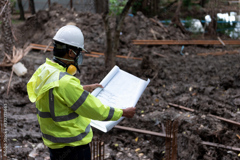 Civil Engineer People wearing safety helmet while inspection detail on ...