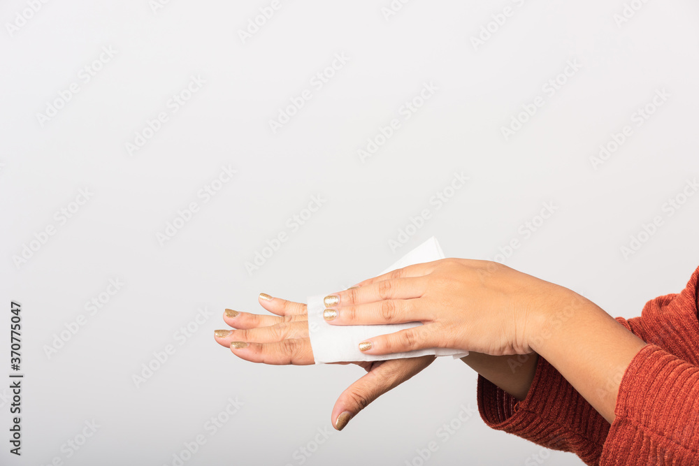 Close up hand of Asian woman she using wet tissue paper wipe cleaning ...