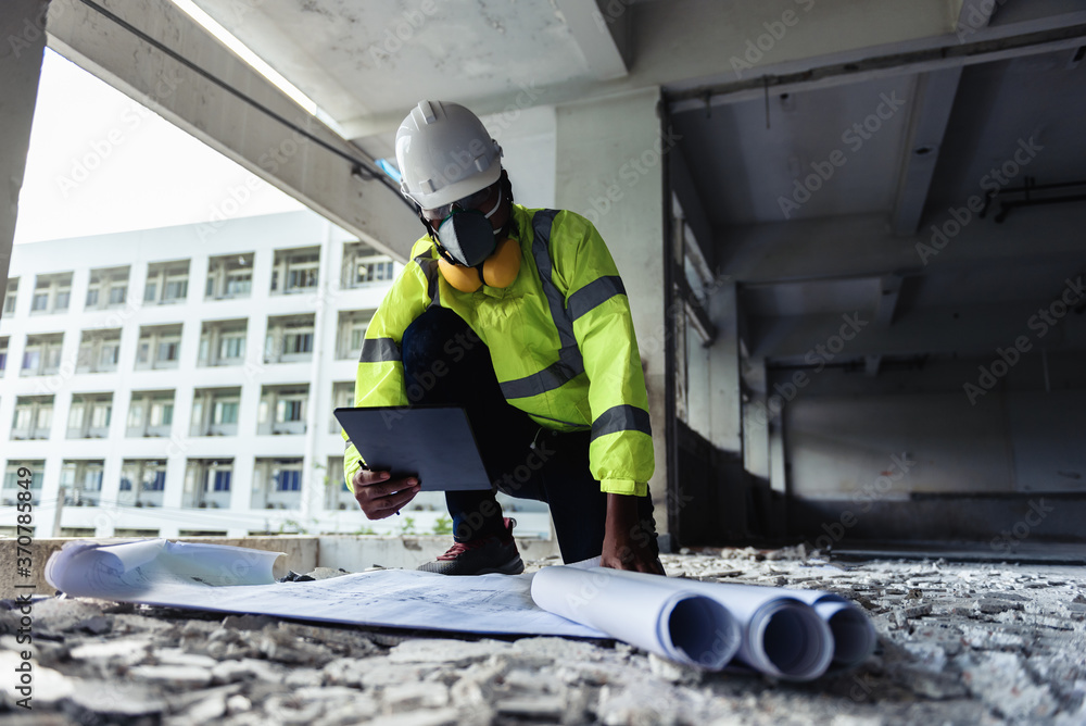 Civil Engineer People wearing face mask and safety helmet while looking ...