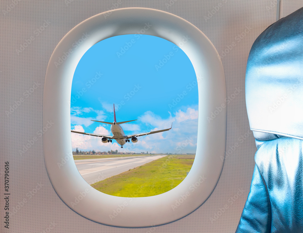 Airport Traffic Concept - Passenger airplane landing to airport seen ...