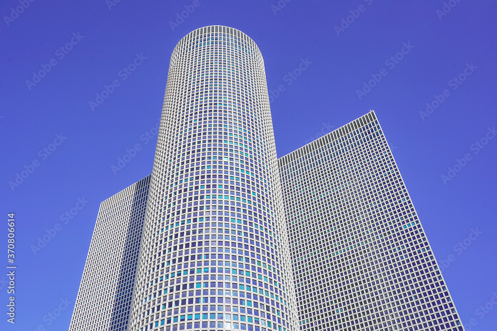 Modern white skyscraper buildings against blue sky. Tall building ...