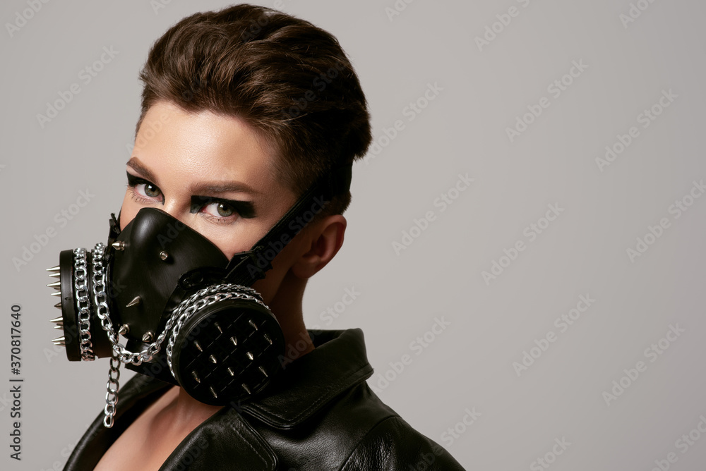 Beautiful woman wearing fashionable face gas mask, respirator with ...