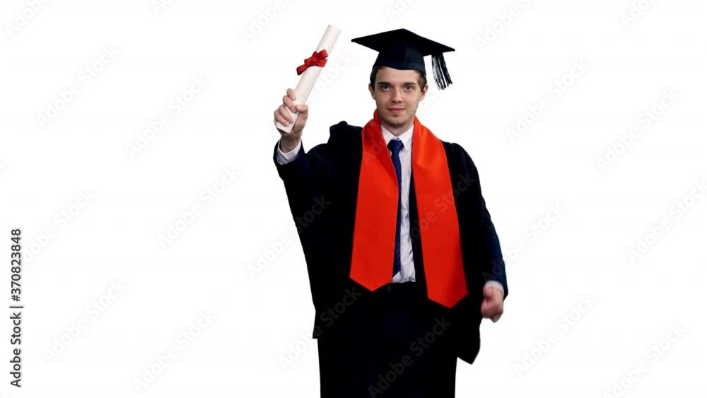 Happy male graduating student rejoices getting diploma while walking ...