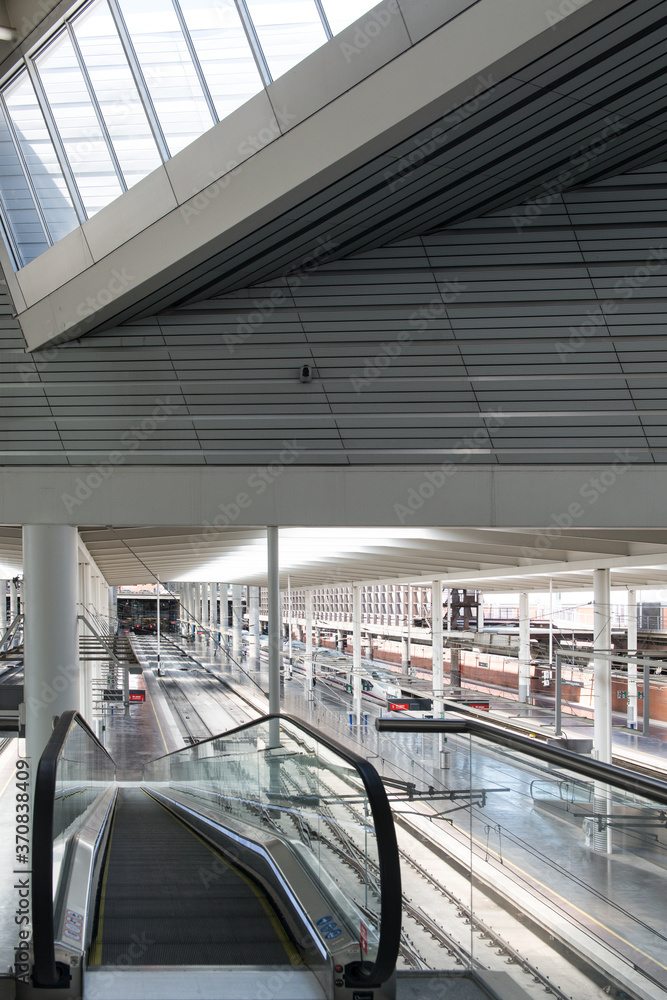Contemporary interior of railroad station with escalator and empty ...
