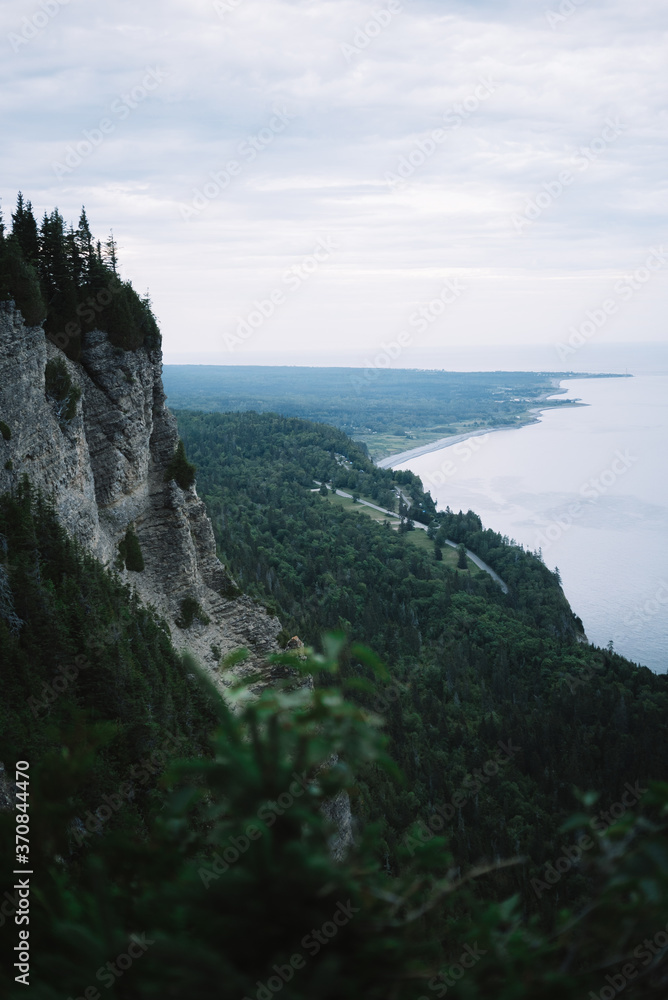 From above of rough cliffs covered with evergreen forest in endless ...