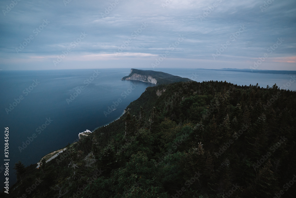 From above of rough cliffs covered with evergreen forest in endless ...