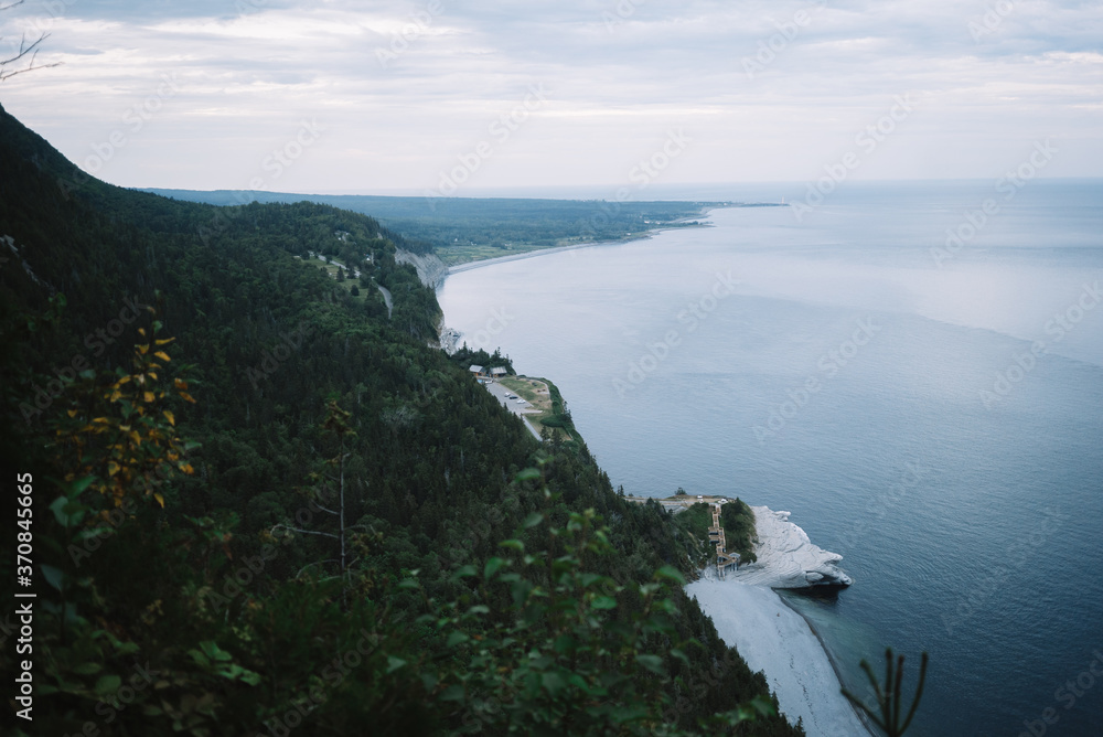 From above of rough cliffs covered with evergreen forest in endless ...