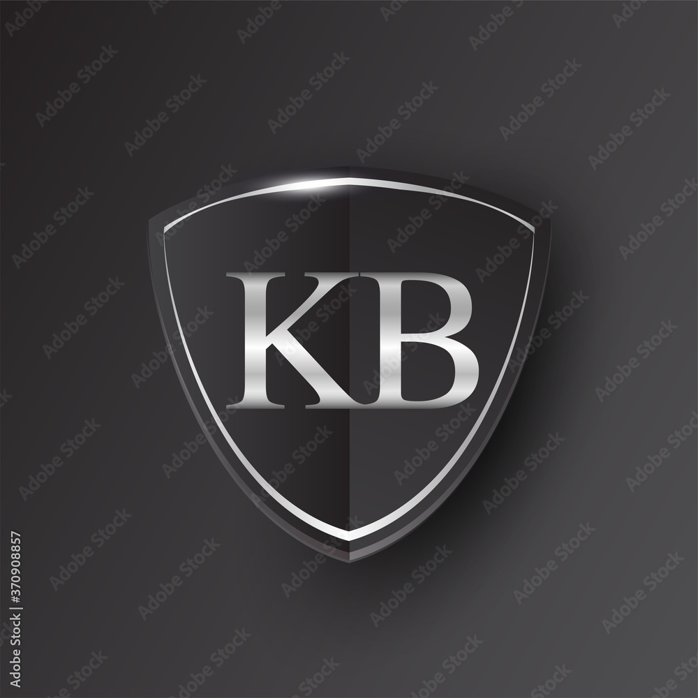 Initial logo letter KB with shield Icon silver color isolated on black ...