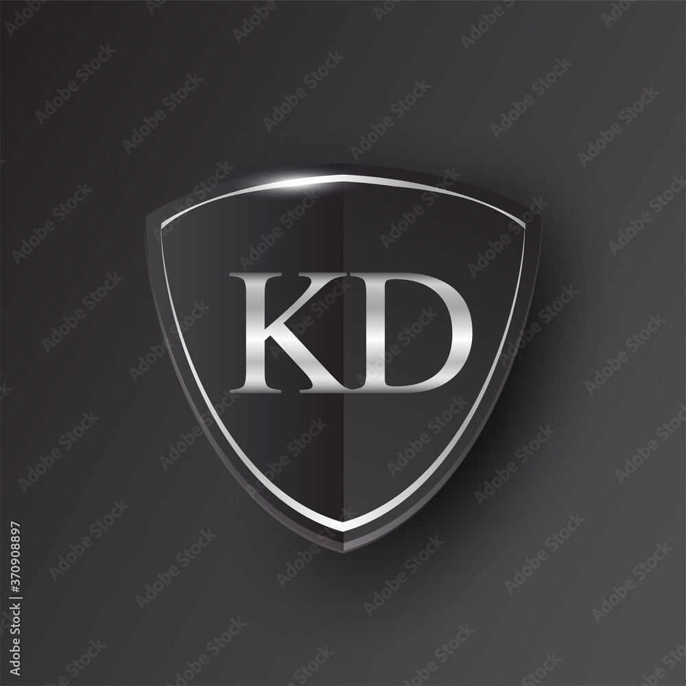 Initial logo letter KD with shield Icon silver color isolated on black ...