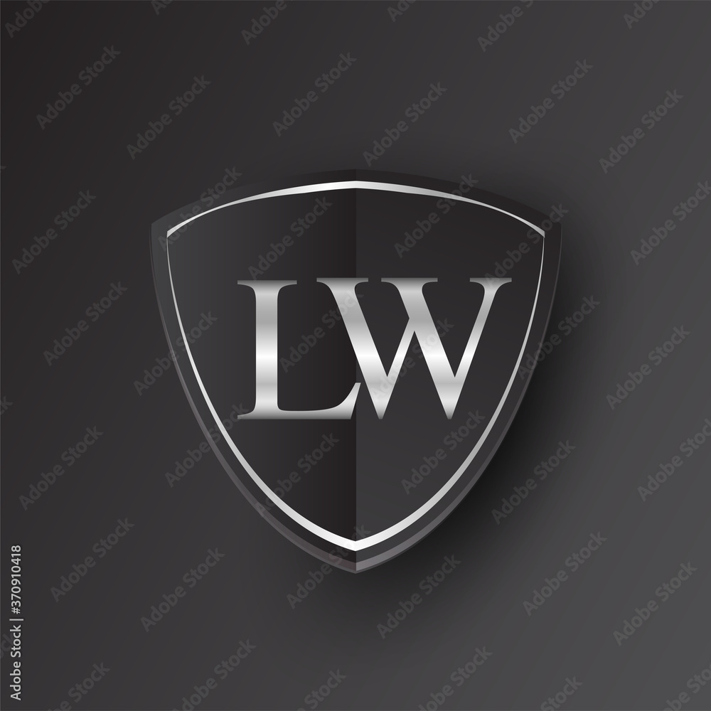 Initial logo letter LW with shield Icon silver color isolated on black ...