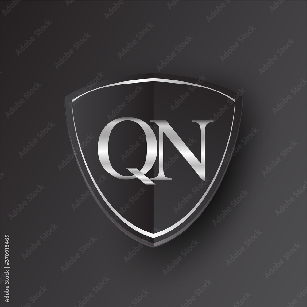 Initial logo letter QN with shield Icon silver color isolated on black ...