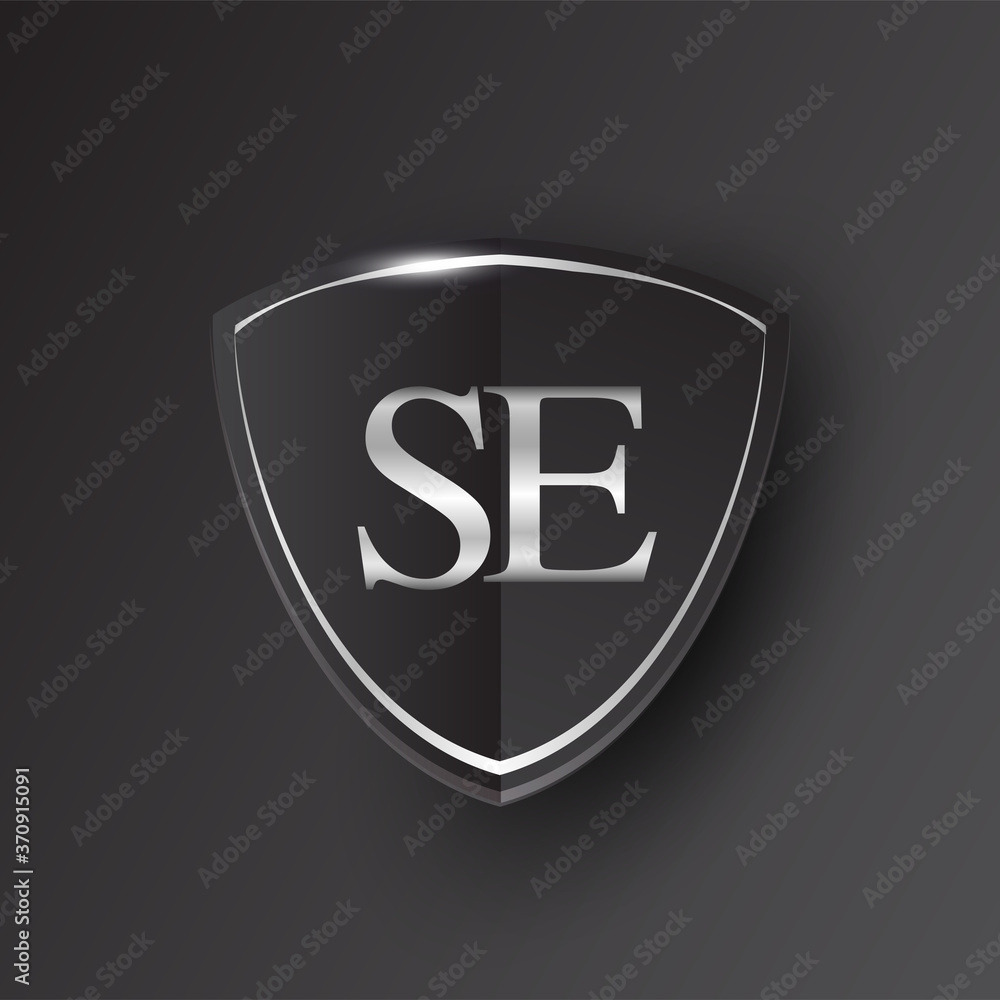 Initial logo letter SE with shield Icon silver color isolated on black ...
