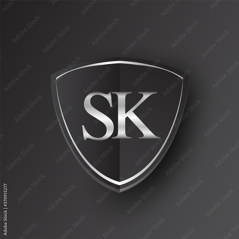 Initial logo letter SK with shield Icon silver color isolated on black ...