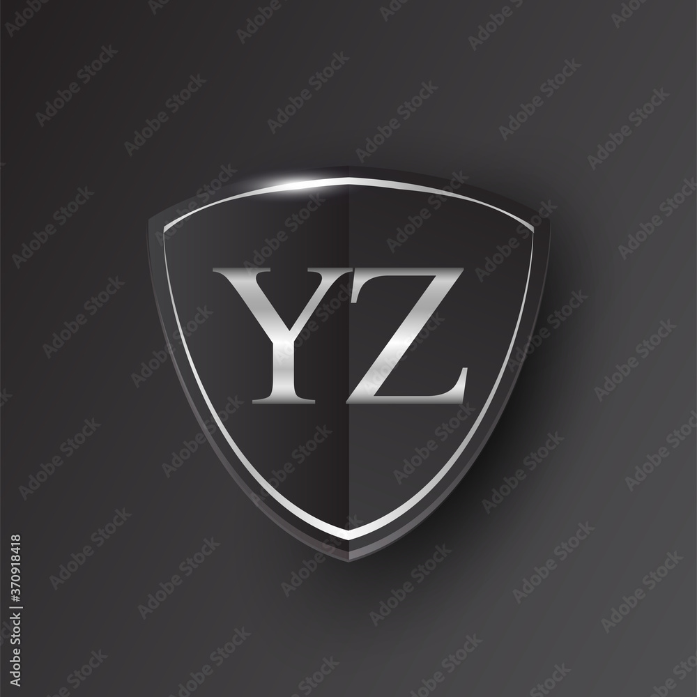 Initial logo letter YZ with shield Icon silver color isolated on black ...