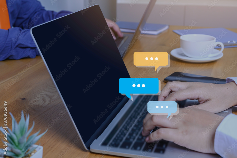 Person hand using computer laptop typing into chat, chatting ...