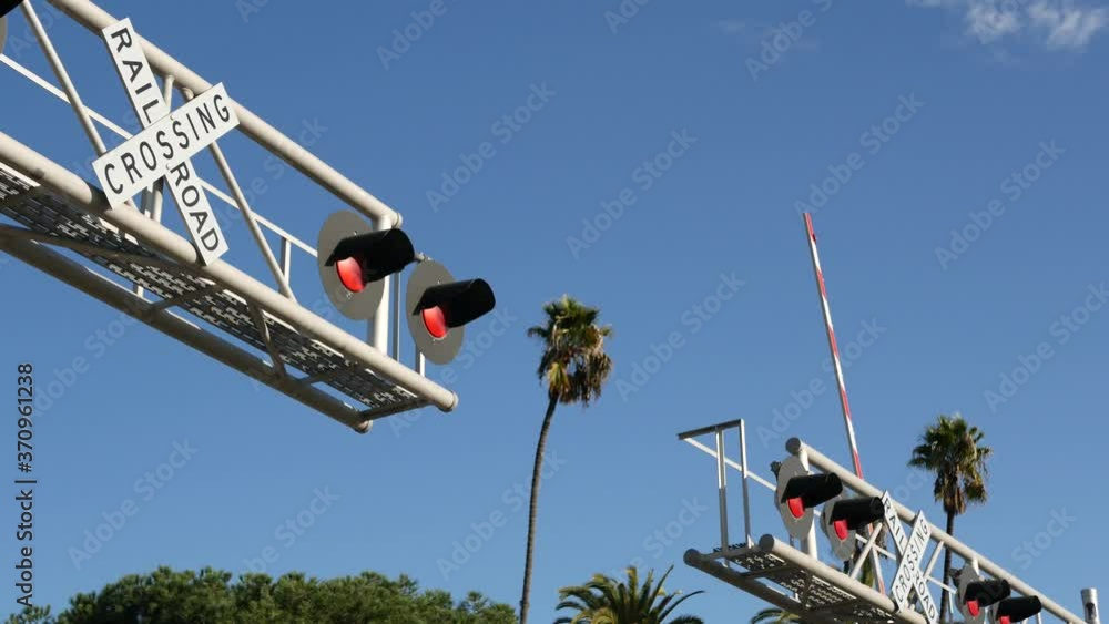 Level crossing warning signal in USA. Crossbuck notice and red traffic ...
