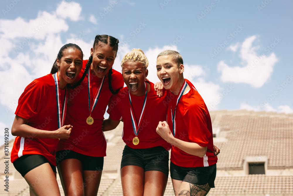 Female football team celebrating the victory Stock Photo | Adobe Stock