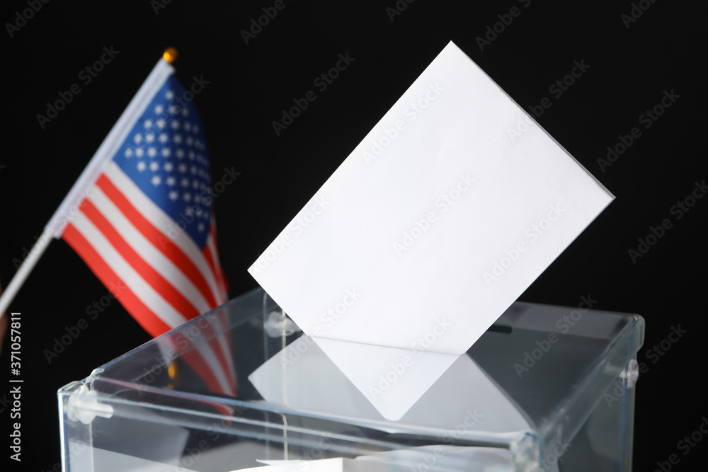 American flag and voting box with ballot on black background Stock ...