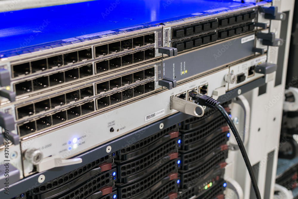 Computer equipment works in the server room of the data center. Front ...