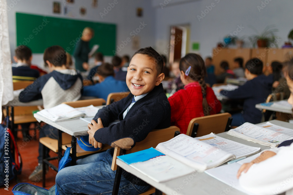 Happy competitive working successful kids in the school, classroom ...