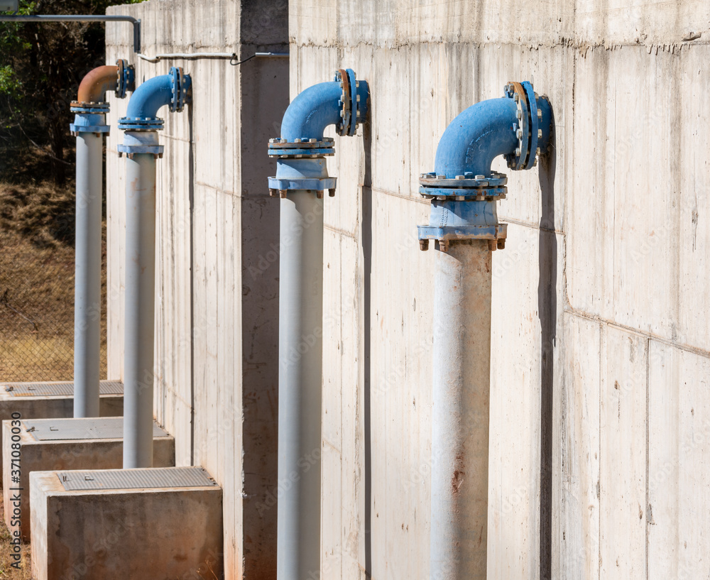 Valves and conduction pipes in a water tank Stock Photo | Adobe Stock