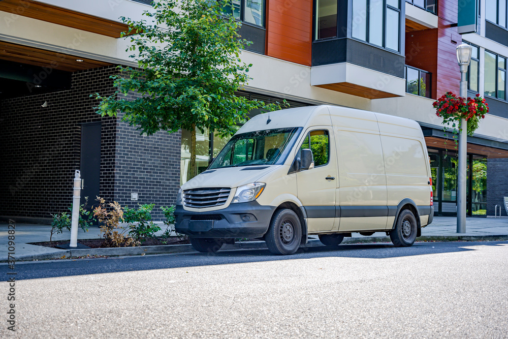 Compact cargo mini van for delivery and small business standing on the ...